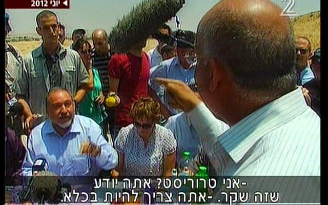 Arab MK steps on image of Liberman in protest of Abbas criticism | The ...