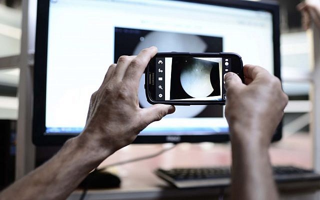 Israelis turn out to see rare 'hybrid' solar eclipse | The Times of Israel