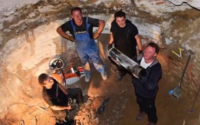 Archaeologists in Poland dig up Nazi time capsule with war-era ...