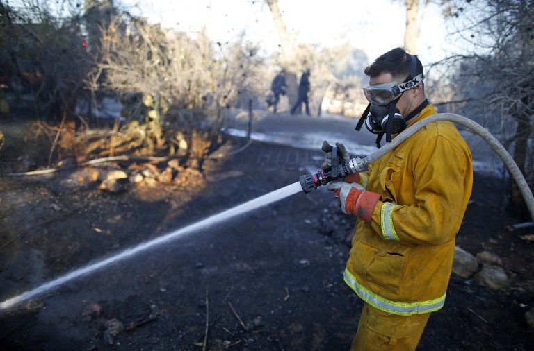 Firefighters working to keep flames from Route 1 | The Times of Israel