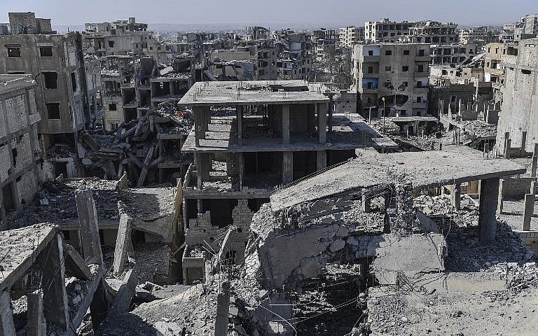 Heartbroken Raqqa residents return to city in ruins | The Times of Israel
