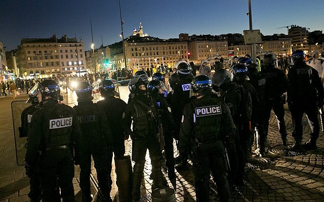 French police hit with poo bombs at 'yellow vest' protests | The Times ...