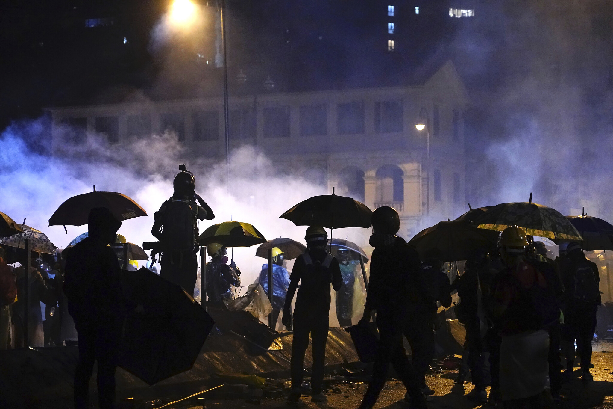 Hong Kong police storm university held by protesters as fires rage ...