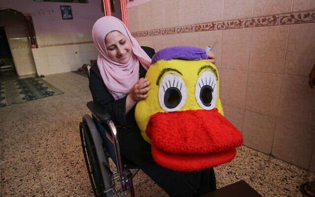 Disabled Gaza couple make dolls, costumes to give their children ...