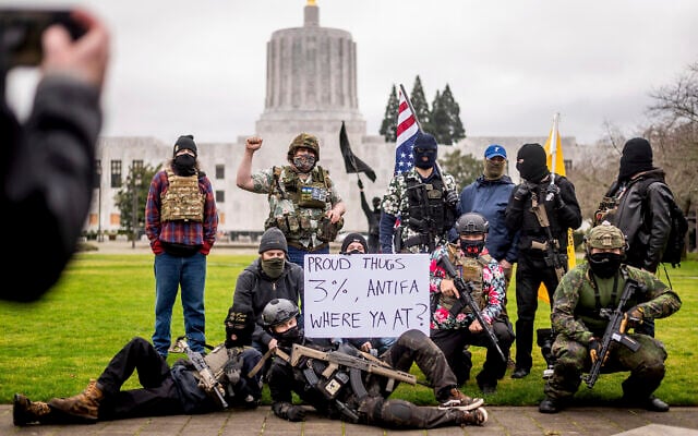 Right-wing protesters, some armed, rally outside fortified statehouses ...