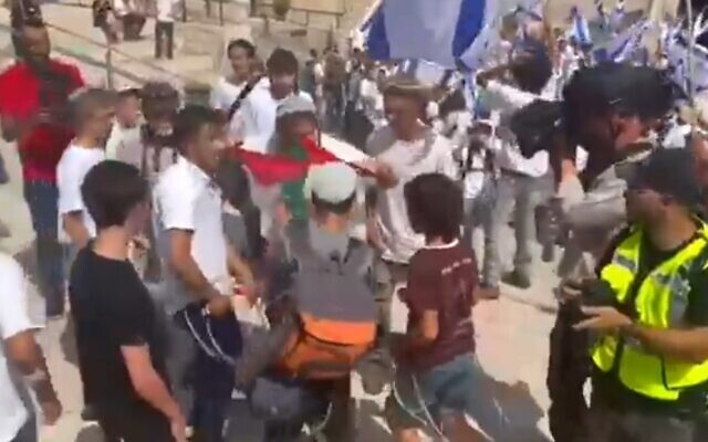Young Israeli tears Palestinian flag at Damascus Gate | The Times of Israel