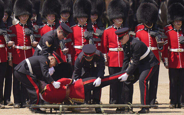 Several British royal guards faint due to heat during ceremony with ...