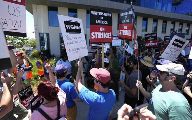 Actors to join screenwriters' strike, effectively shutting down ...
