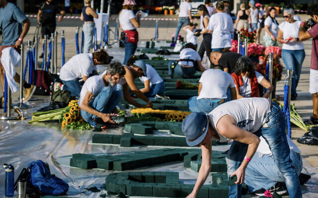 Thousands of flowers woven into words, in memory of Israelis killed ...