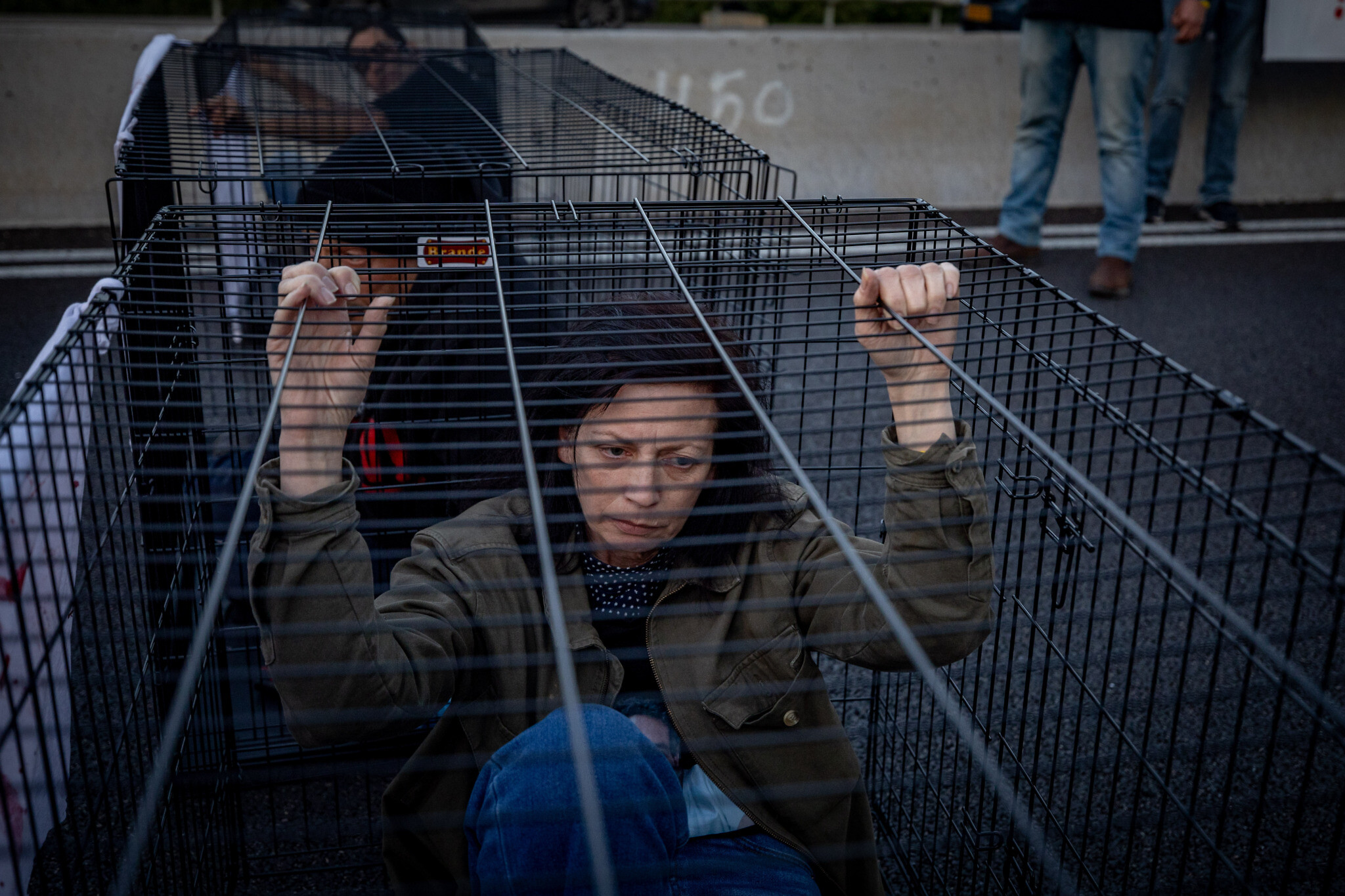 Hostage families block main highway with cages; report says new signs ...