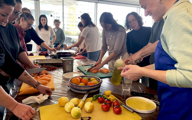 'Kibbutz Tel Aviv' evacuees cook up some solace in culinary workshops ...