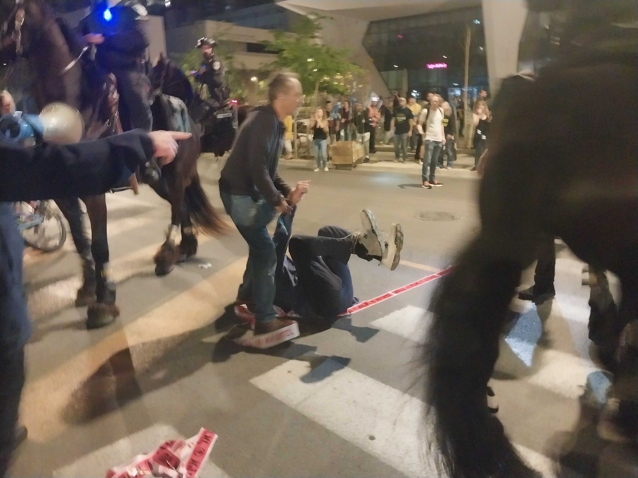 Car rams protesters, injuring 5, as large crowds in Tel Aviv demand ...