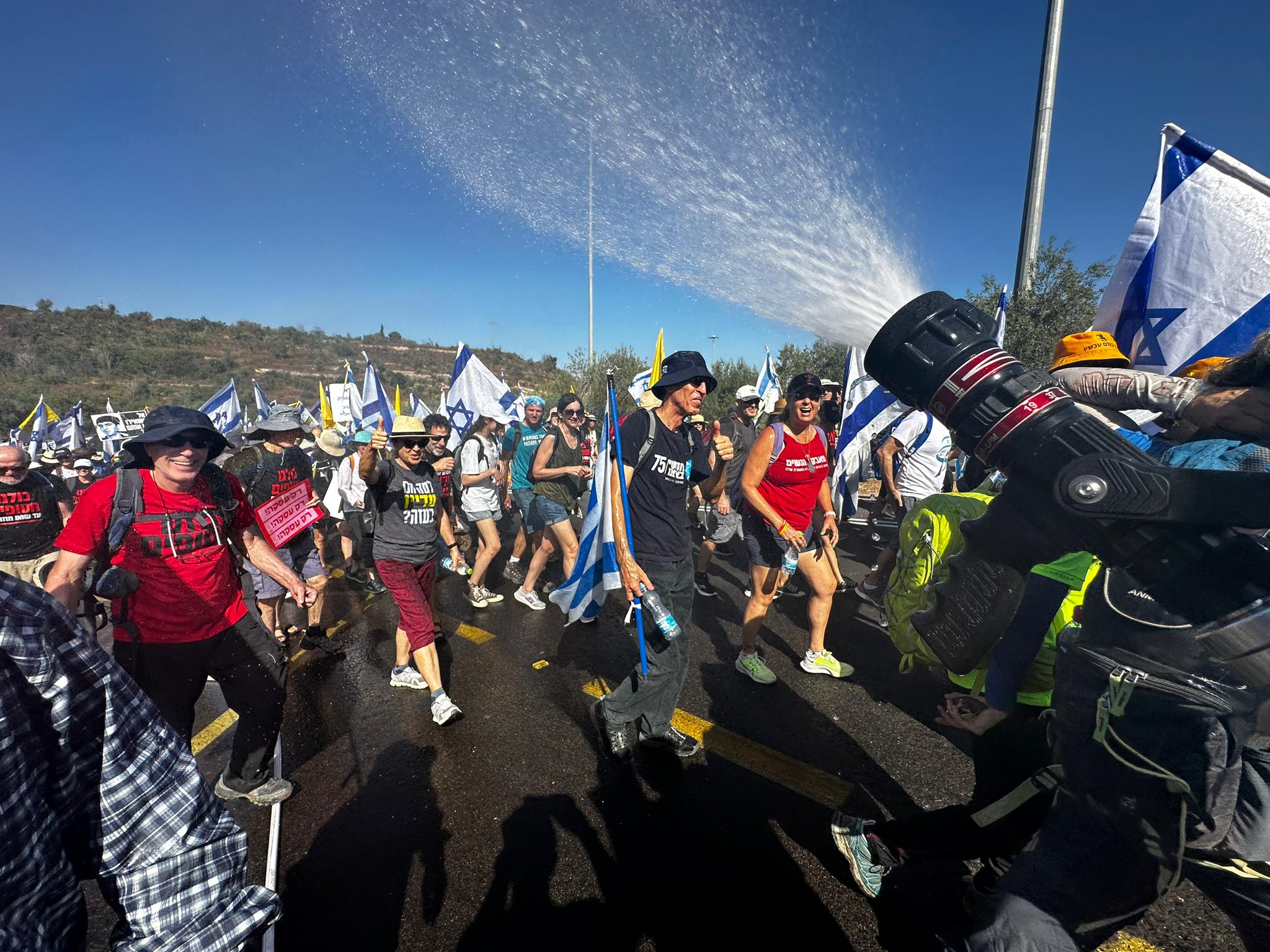 In intense heat, activists for hostages continue protest march to ...
