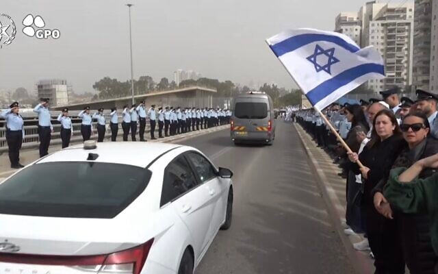 Police officers, civilians line the road as funeral procession for Ran ...