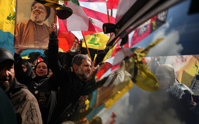 Lebanon PM cancels trip to US as Hezbollah supporters rally in Beirut ...