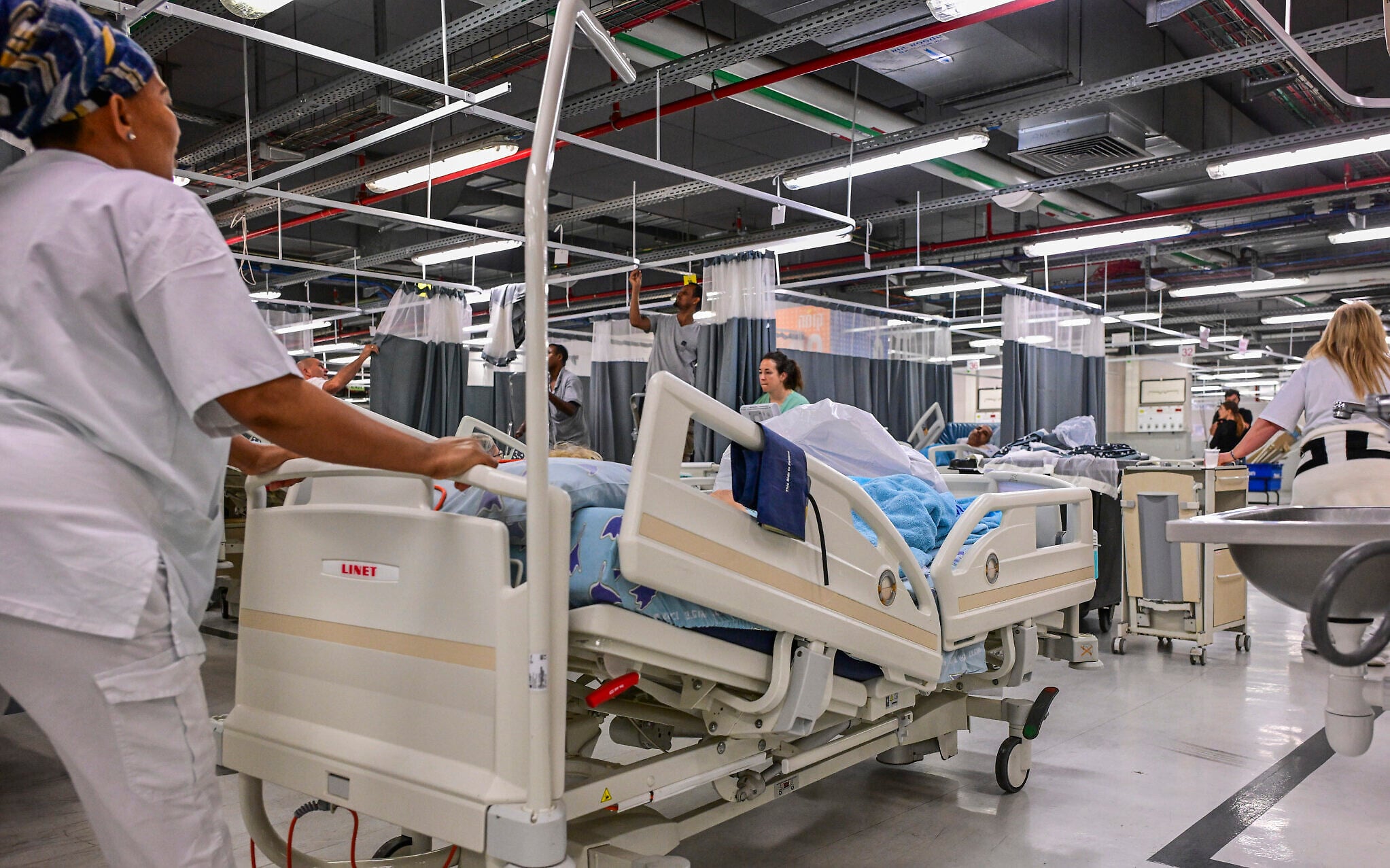 Hospitals move operations underground as Iran fires missiles at Israel